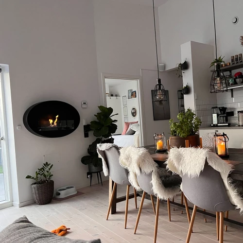 Black oval bio fireplace in a round design for wall-mounting